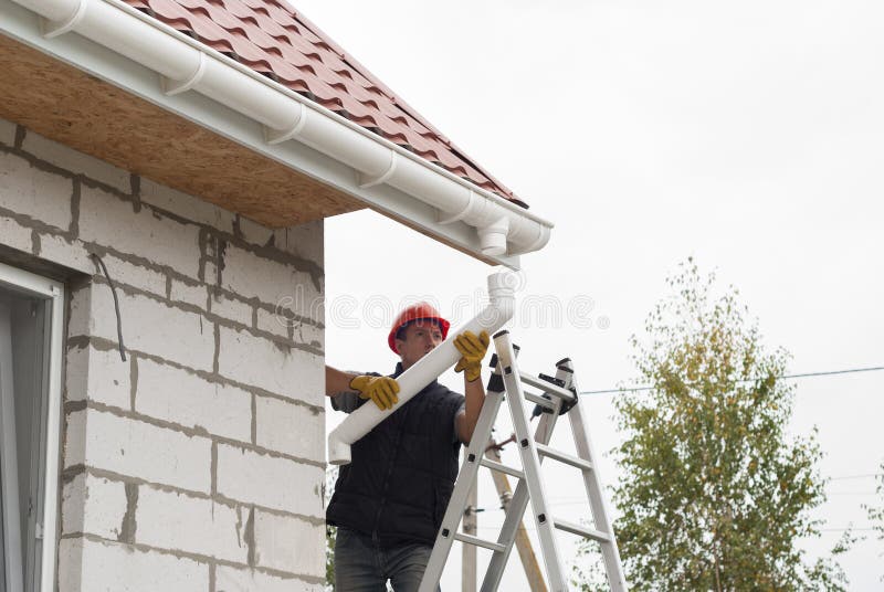 Installation gutter system stock photo. Image of contractor - 102304996
