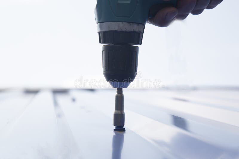 Installation of Iron Material on the Roof of the House.Metal Tile of ...