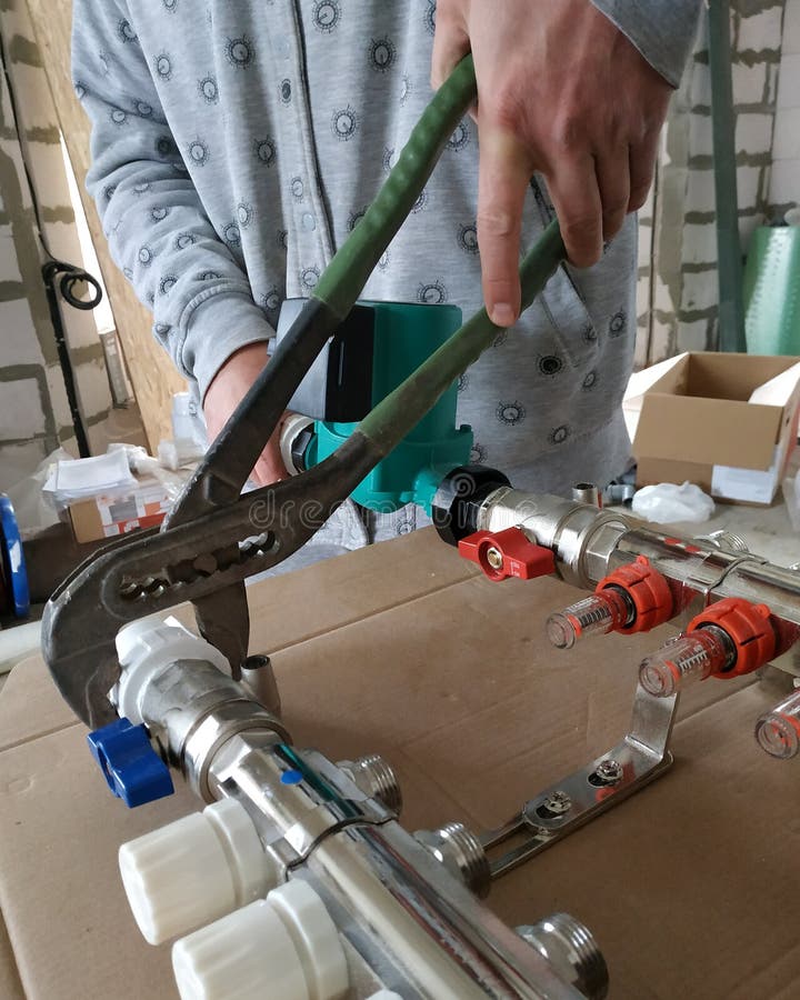 Installation of the Main Adjusting Manifold for the Home Heating System ...