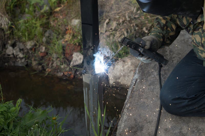 Installation of a Metal Column Using a Welding Machine Stock Photo ...