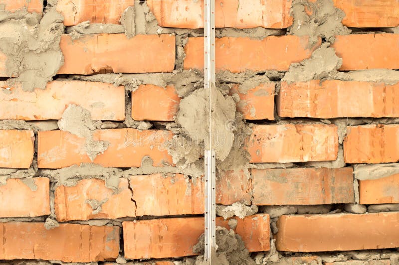 Installation of Metal Lighthouses on a Brick Wall Stock Image - Image ...