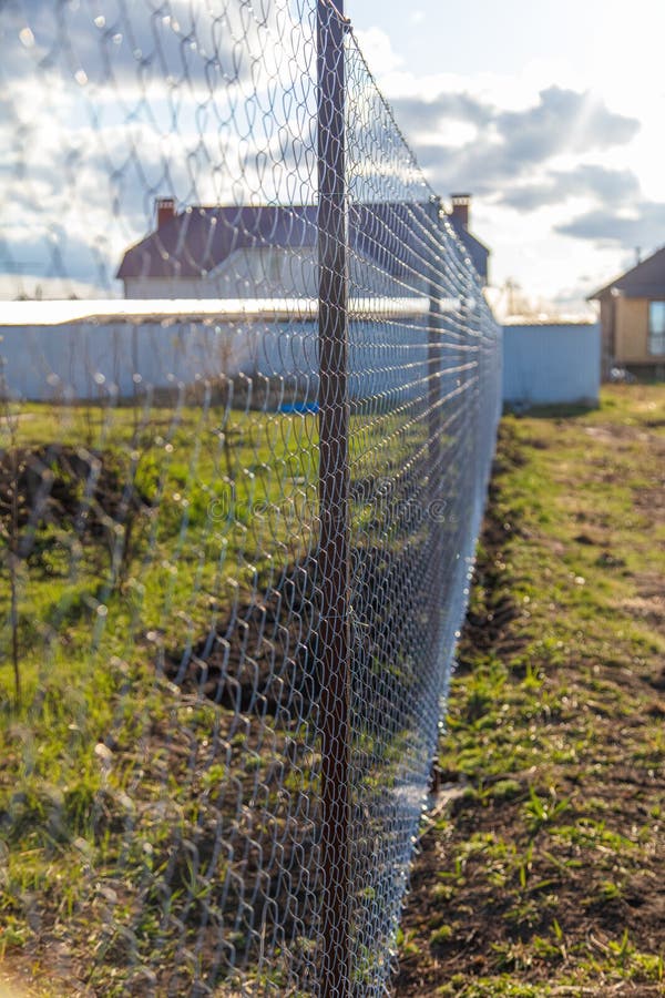 Installation of a Metal Mesh on the Fence. Stock Image - Image of ...