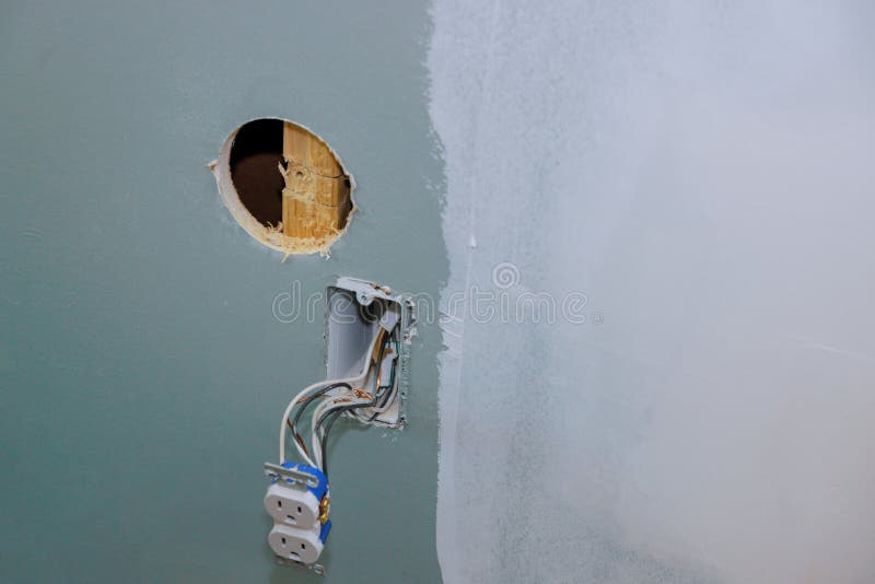 Installation of a New Current Socket by an Electrician Working in a ...