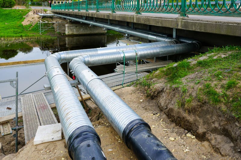 Installation of a New Heating Pipeline in a Galvanized Metal Casing ...