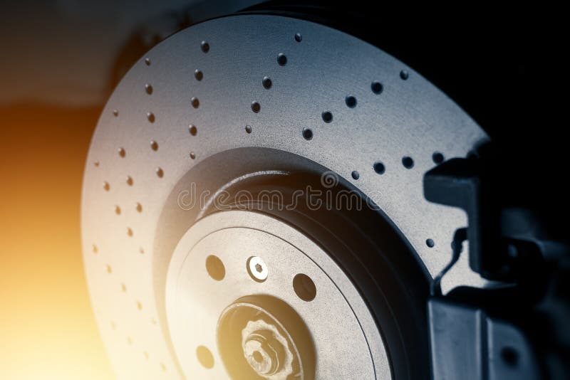 Installation of New Perforated Brake Discs and Pads on a Modern Auto in ...