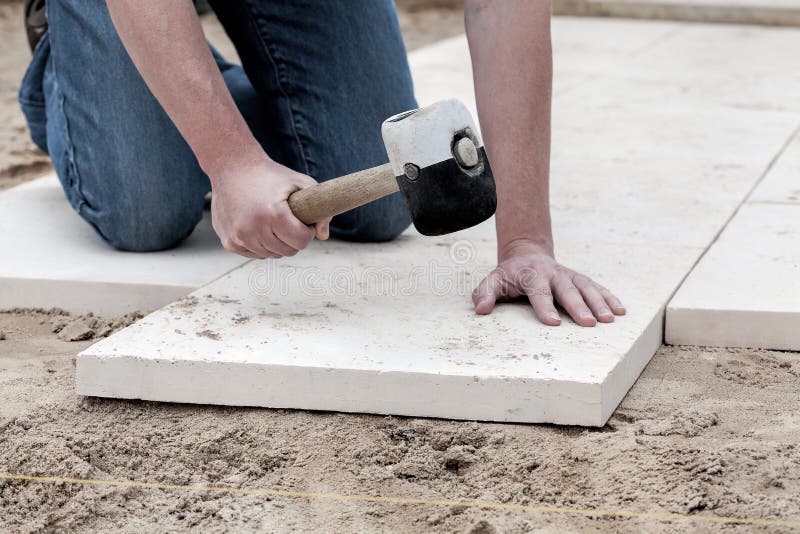 Installation of Paving Slabs Stock Image - Image of hammer, hand: 33892599