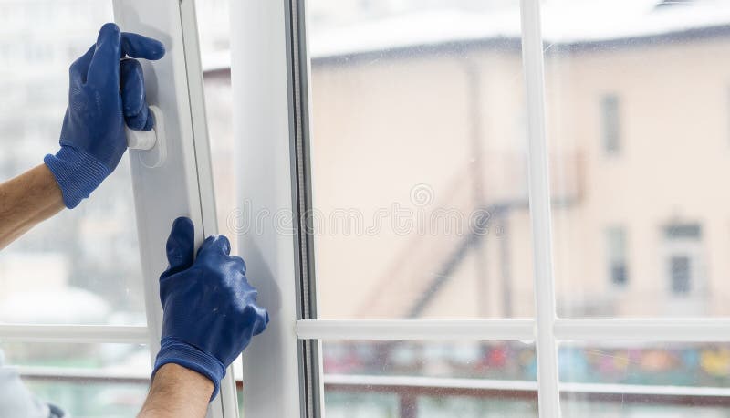 Installation of Plastic in a Frame House, the Builder Screws the Window ...