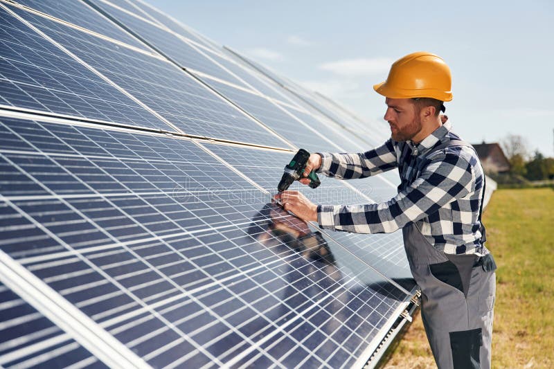 Installation Process, with Drill. Engineer with Photovoltaic Solar ...