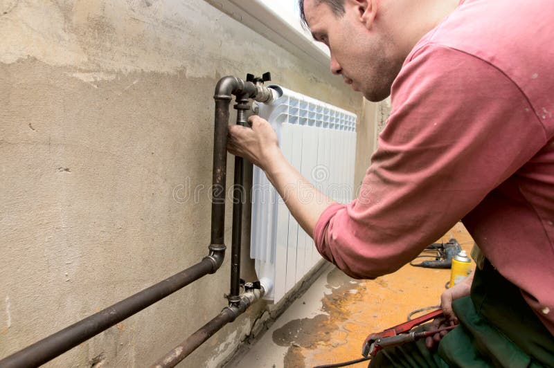 Installation of a radiator stock photo. Image of pipe - 24920426
