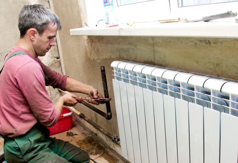 Installation of a radiator stock photo. Image of metal - 24620948