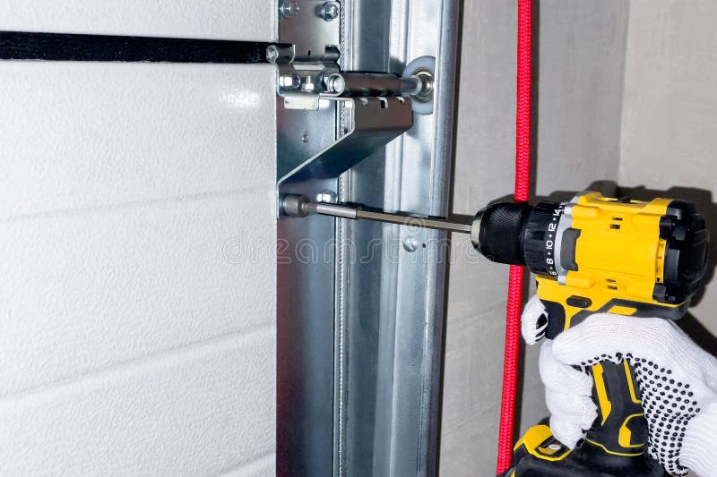 Installation of Sectional Door Rails Stock Photo - Image of assembler ...