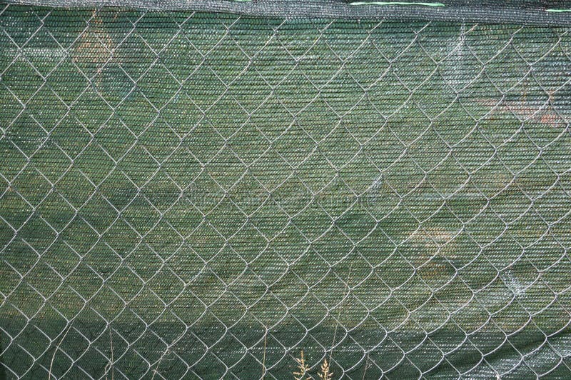 Installation of a Shading Net on a Chain-link Fence Stock Image - Image ...