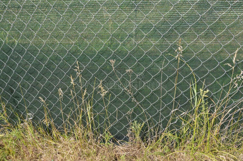 Installation of a Shading Net on a Chain-link Fence Stock Image - Image ...