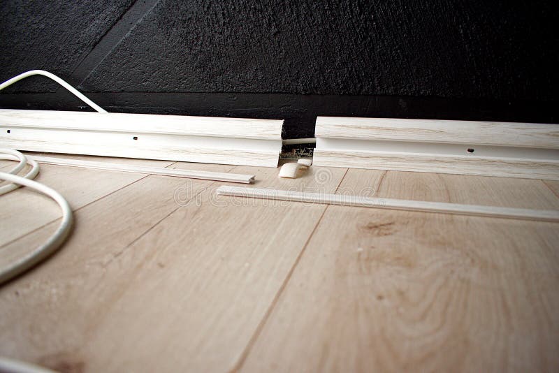 Installation of Skirting Boards and Electrical Wiring in Them ...