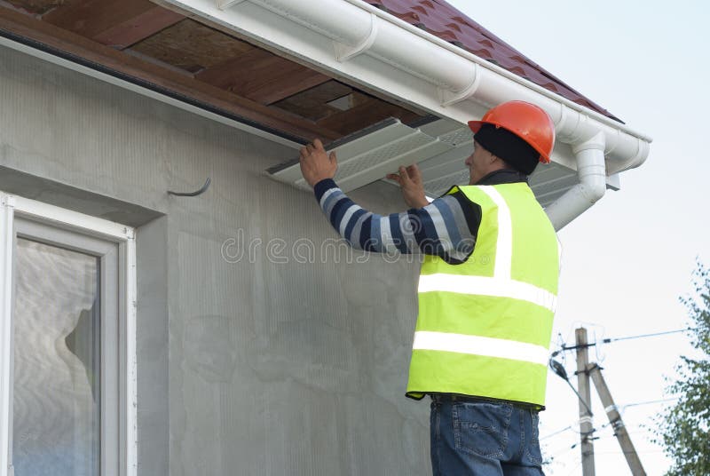 Installation of soffits stock photo. Image of install - 128744818