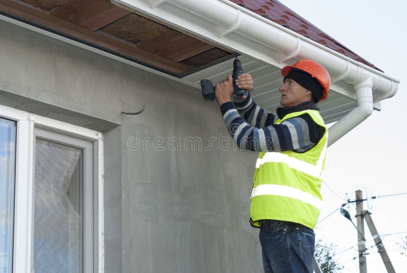 Installation of soffits stock image. Image of beam, home - 128744849
