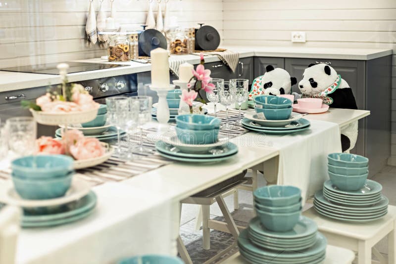 Installation in the Store. Kitchen, Two Pandas are Sitting at the Table ...