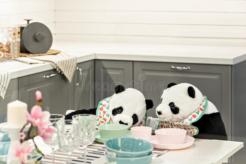 Installation in the Store. Kitchen, Two Pandas are Sitting at the Table ...