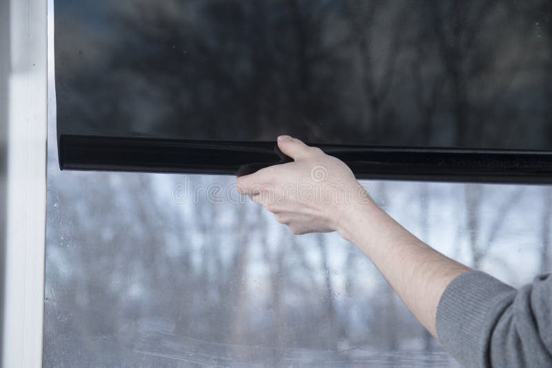 Installation of Window Film in the Office. Protection from Ultraviolet ...