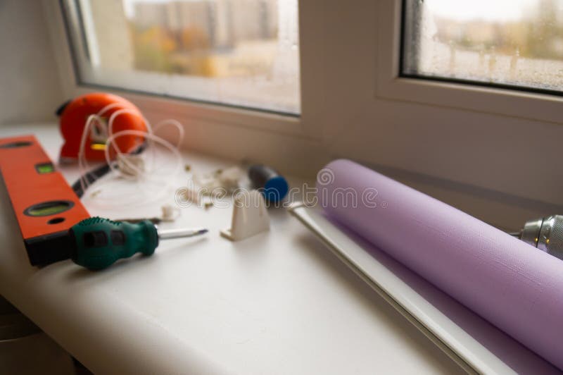 Installation of a Window Roller with a Holder. Installation Tool ...