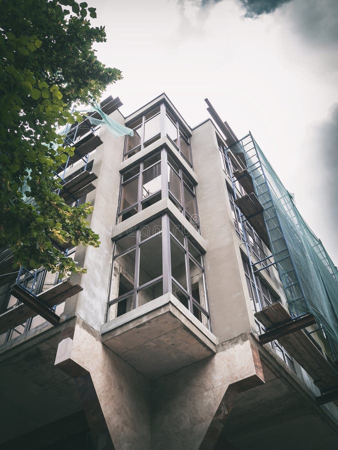 Installation of Windows on Balconies in a Building Under Construction ...