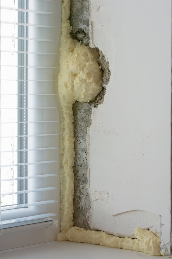 Installation of Windows. Polyurethane Foam on the Slope of the Window ...
