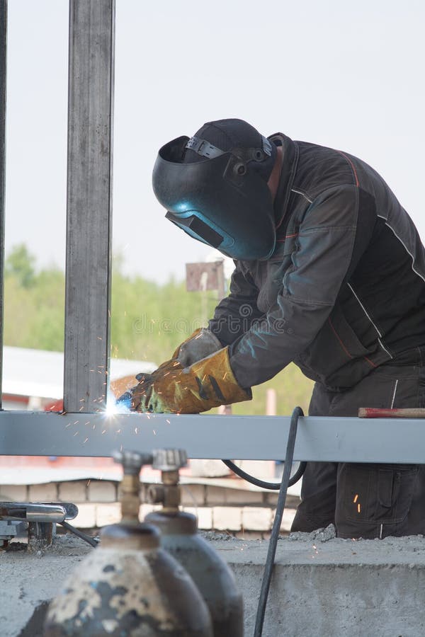 Installation Work of Electric Welding on a Clear Sunny Day at a ...