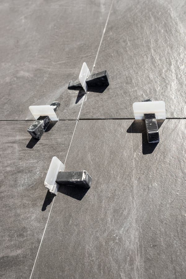Installed Ceramic Tiles with Plastic Tile Leveling System Clips and ...