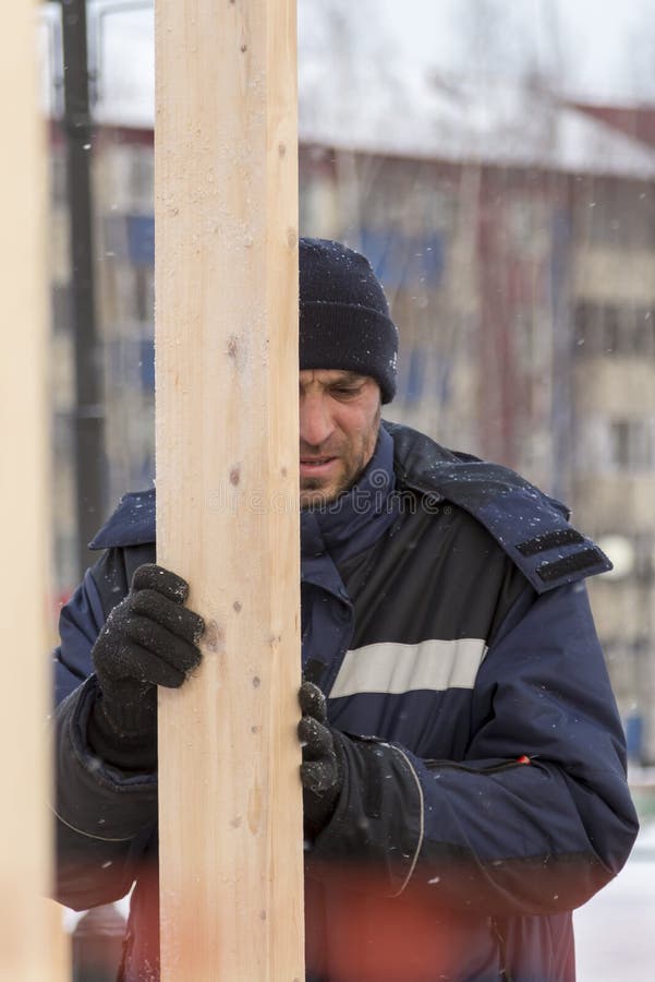 Worker Assembling the Frame of a Wooden Slide Stock Photo - Image of ...