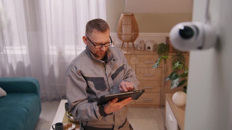 Installer Sets Up Security Camera Using Tablet Stock Footage - Video of ...