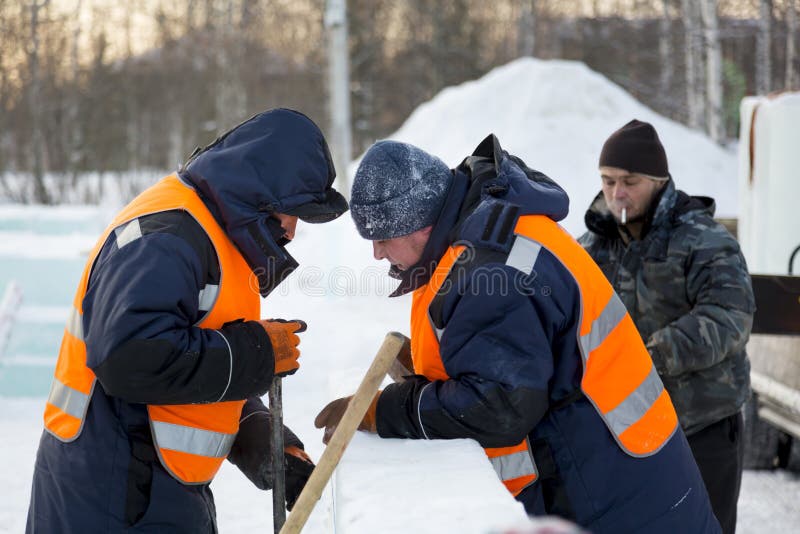 Workers in Winter Workwear Installing Ice Panels Stock Photo - Image of ...