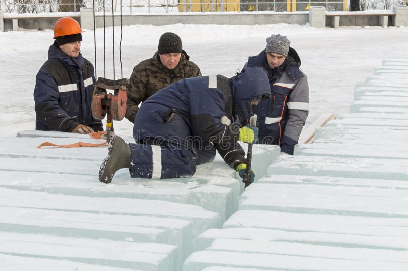 Four Workers at the Assembly Site of the Ice Town Stock Image - Image ...