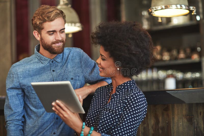 Installing an App for Their Waiters. a Young Man and Woman Using a ...