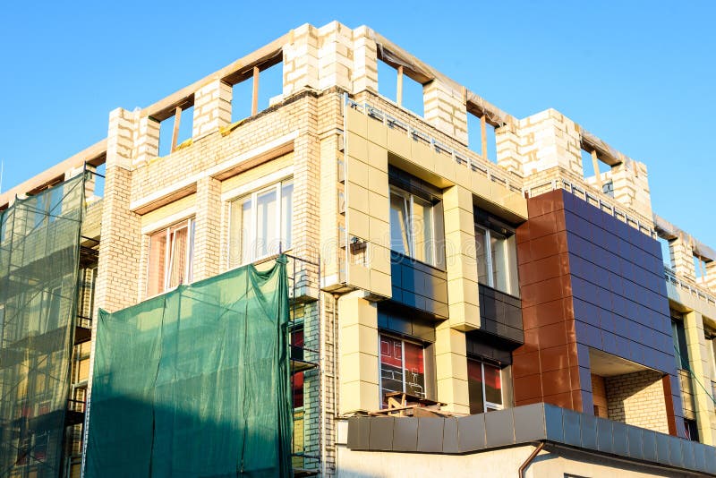 Installing Big Tile on a Building Facade Stock Photo - Image of ...