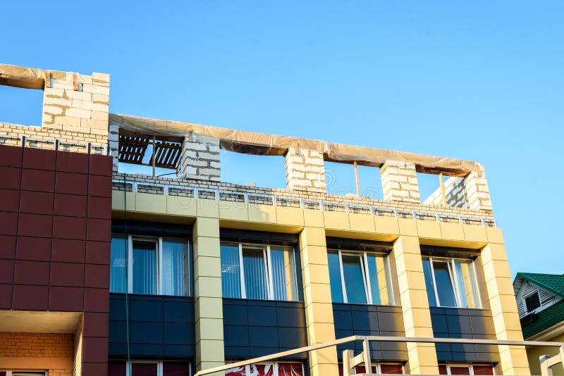 Installing Big Tile on a Building Facade Stock Photo - Image of ...