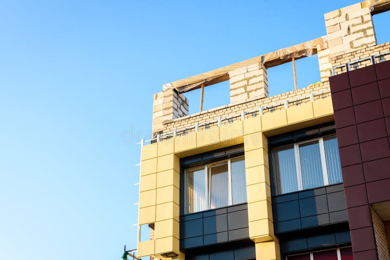 Installing Big Tile on a Building Facade Stock Photo - Image of roof ...