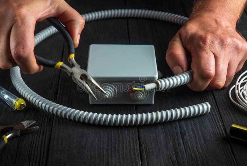 Installing a Cable or Wire To Gray Junction Box. Electrical Connection ...