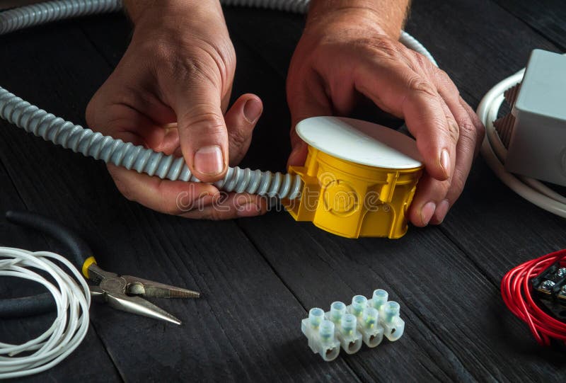 Installing Cable or Wire To a Junction Box. Electrical Connection in ...