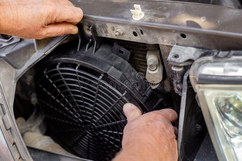 Installing a Car Engine Cooling Fan Under the Radiator Grille. Car ...
