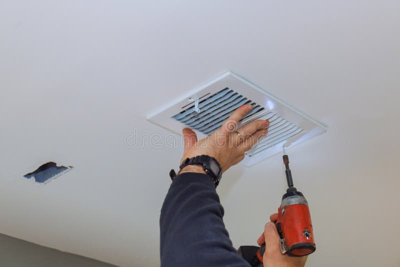 Installing a Ceiling Vent in a Residential Home during a Home ...