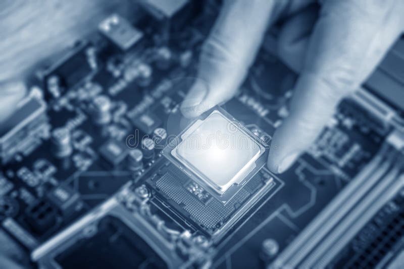 Installing Central Processor Unit into Computer Motherboard Stock Photo ...