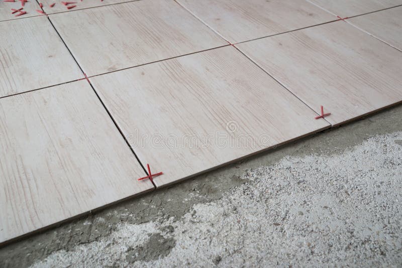 Installing Ceramic Floor Tile Stock Photo - Image of positioning, floor ...