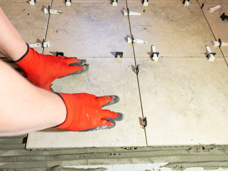 Installing Ceramic Floor Tiles - Placing the Tile into the Adhesive ...