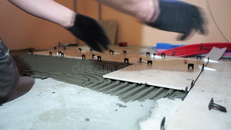 Installing Ceramic Floor Tiles - Placing the Tile into the Adhesive ...