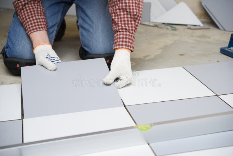 Installing Ceramic Tiles on a Floor Stock Photo - Image of white ...