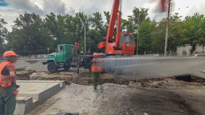 Installing Concrete Plates by Crane at Road Construction Site Timelapse ...