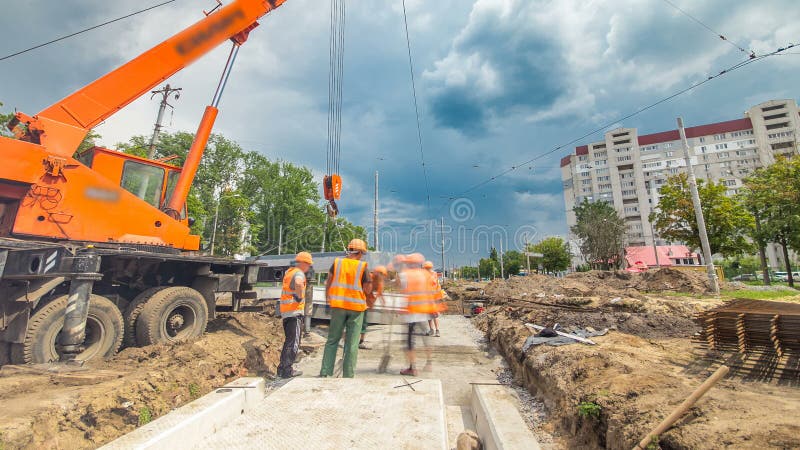 Installing Concrete Plates by Crane at Road Construction Site Timelapse ...