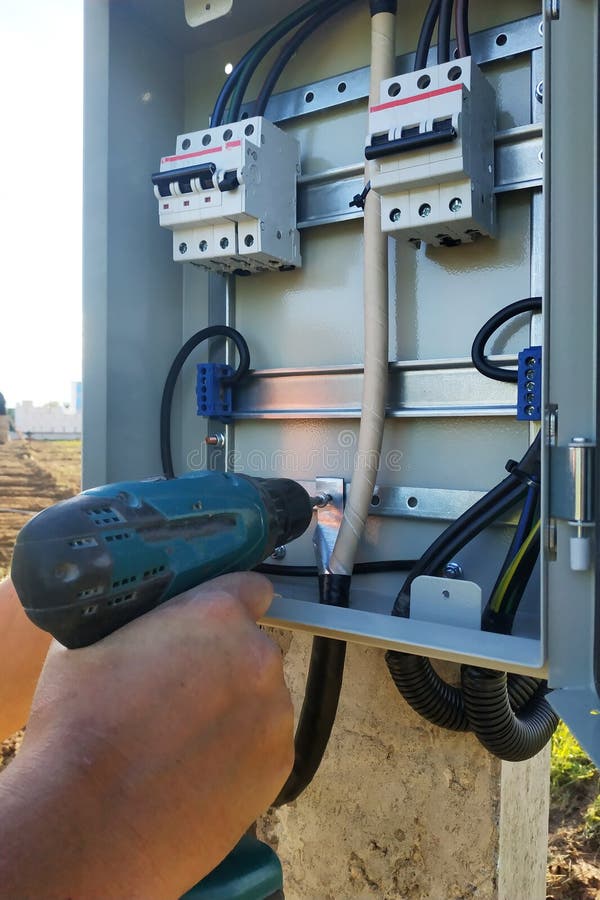 Installing and Connecting an Electrical Panel on the Street Stock Photo ...