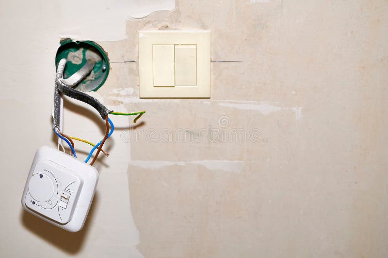 Installing and Connecting a Light Switch into the Wall Stock Photo ...