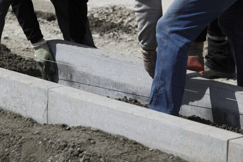 Installing Curbstone on Street Stock Photo - Image of cement, street ...